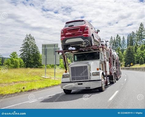 Capacious Car Hauler Big Rig Semi Truck Transporting Cargo On Modular
