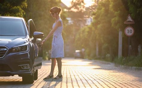 Premium Photo Young Woman Driver Getting Inside Her Car
