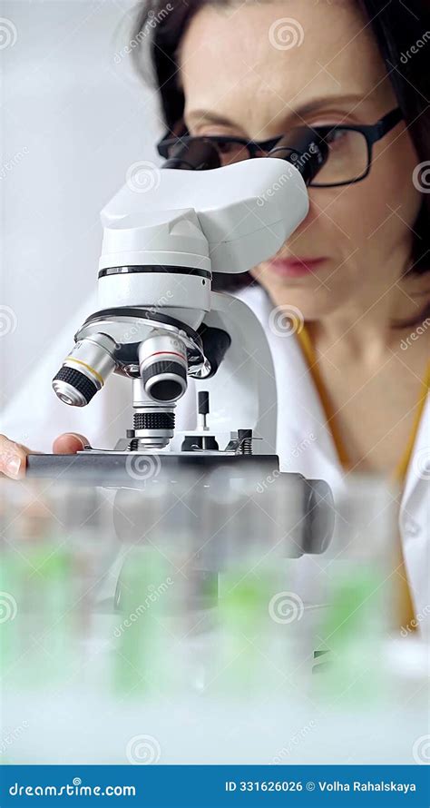 Woman Scientist Using Microscope In Laboratory Microbiology Science