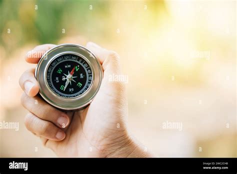 In The Forest A Hiker Navigates Confusion With A Compass In Hand The