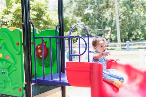 Premium Photo Girl Looking Away While Sitting Outdoors