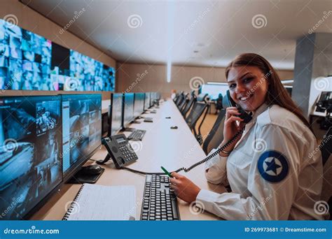 Female Security Operator Working In A Data System Control Room Offices Technical Operator