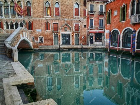Premium Photo High Angle View Of Canal By Buildings