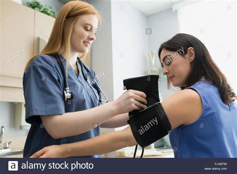 Putting On Blood Pressure Cuff Hi Res Stock Photography And Images Alamy