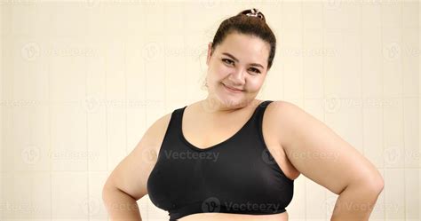 Happy chubby woman standing in the room. 11556156 Stock Photo at Vecteezy