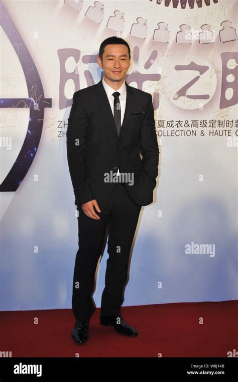 Chinese Actor Huang Xiaoming Poses As He Arrives For The Zhang Shuai 2016 Spring Summer