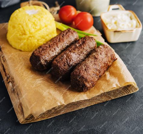 Premium Photo Traditional Romanian Grilled Dish Mici Or Mititei