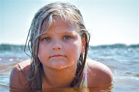 Premium Photo Close Up Portrait Of Girl At Beach
