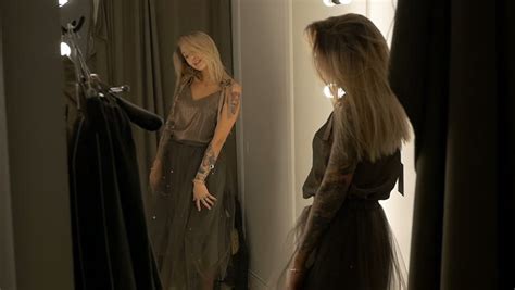 The Girl Measures The Clothes Stock Footage Video Royalty Free Shutterstock