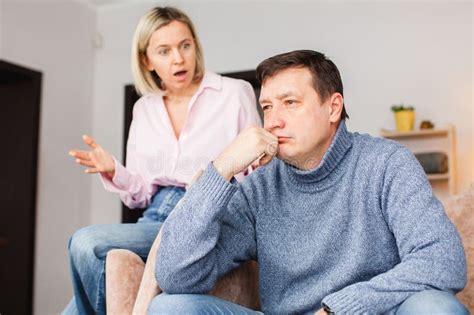 Angry Middle Aged Couple Arguing Shouting Blaming Each Other Of Problem