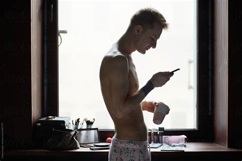 Babe Man Standing Near Window By Stocksy Contributor Clique Images Stocksy