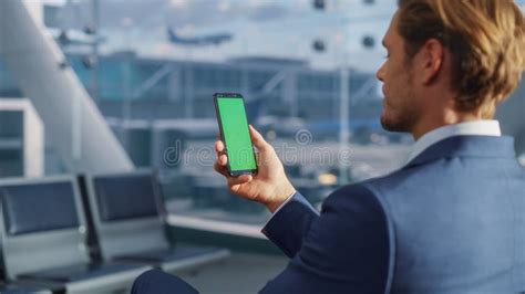 Airport Terminal Businessman Working On Green Chroma Key Screen Mobile