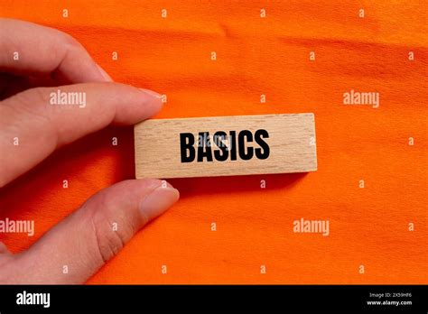 Basics Word Written On Wooden Block With Orange Background Conceptual