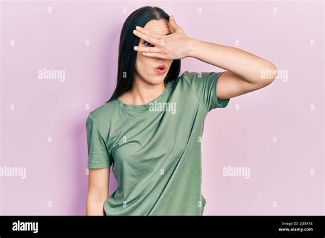 Beautiful Woman With Blue Eyes Wearing Casual T Shirt Peeking In Shock Covering Face And Eyes