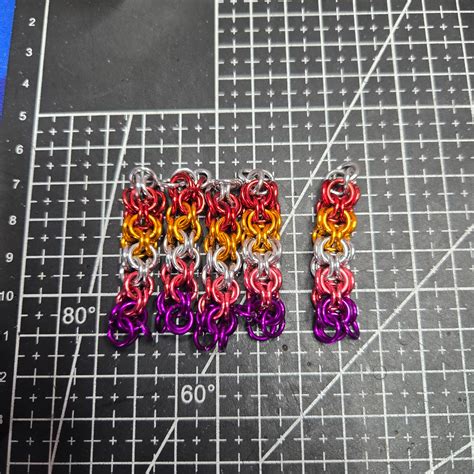 Had A Nice Productive Morning A Batch Of Lesbian Pride Chain Pendants And A Rainbow Scale Crown