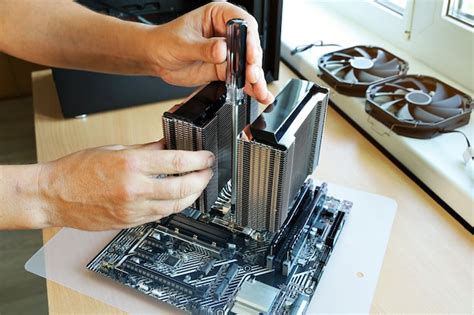 Premium Photo Assembling Powerful Cooling Cooler On Processor On Motherboard