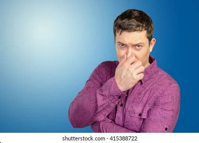 Portrait Disgusted Man Pinches Nose Fingers Stock Photo Shutterstock