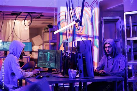 foto stock hackers collaborating while coding virus software doing