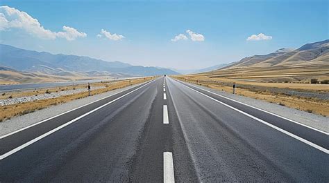 View Of Highway Asphalt Road Going Into The Distance Background