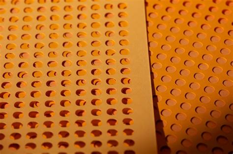 Premium Photo View Of Perforated Sheet Of Material