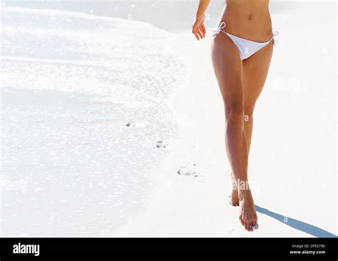 Bikini Ready Legs A Cropped View Of A Pair Of Shapely Legs Walking On