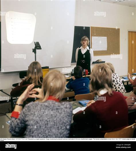 In The 1970s A School Class Sits In The Benches During A Lesson With A
