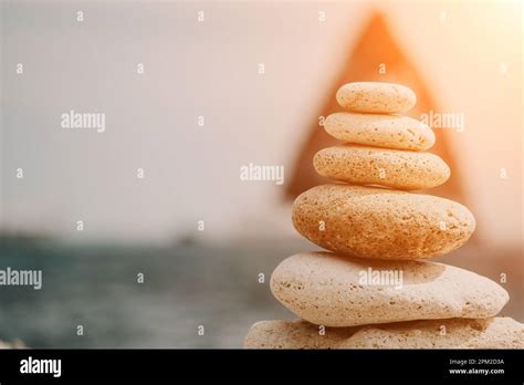 Balanced Rock Pyramid On The Pebbled Beach Is A Study In Harmony And