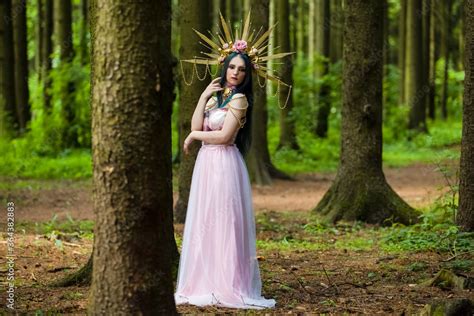 Costume Play Concepts Sexy And Sensual Crowned Forest Nymph With Flowery Golden Crown Posing In