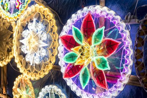 A Stall By The Street Selling Various Lighted Christmas Parols Parols