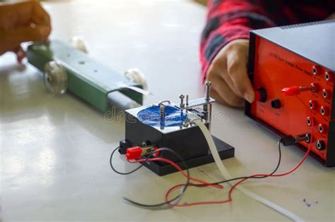 Science Classroom Students Are Conducting A Physics Experiment On The Speed Of Objects Using A