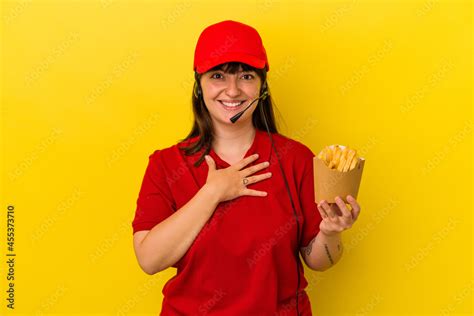 Young Curvy Caucasian Woman Fast Food Restaurant Worker Holding Fries