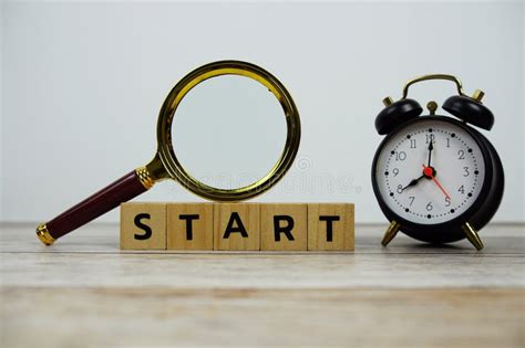 Time To Start With Wooden Blocks Alphabet Letters And Magnifying Glass On Wooden Background