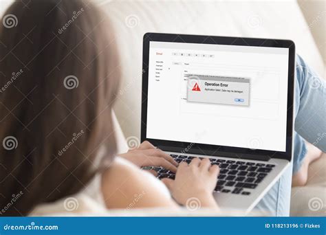 Woman Lying On Sofa Looking At Laptop Operation Error Message Stock Photo Image Of Broke