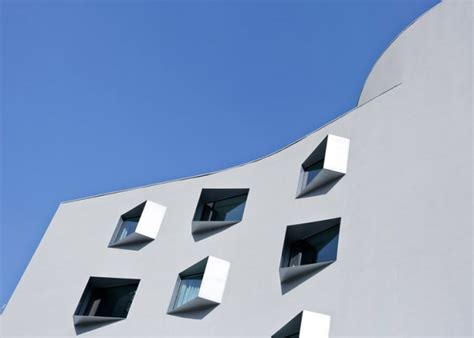 open architecture completes a school surrounded by gardens