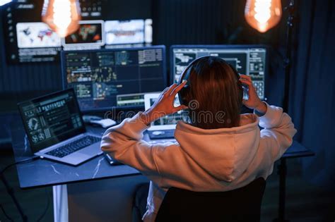 Wearing Headphones Young Professional Female Hacker Is Indoors By