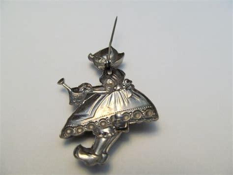 Metal Pin Dutch Girl With Sprinkling Can Brooch Uni… Gem