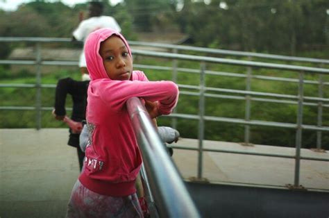 Premium Photo Side View Portrait Of Girl Leaning On Railing