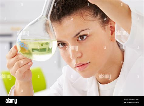 Female Scientist Studying Liquid In Flask Stock Photo Alamy
