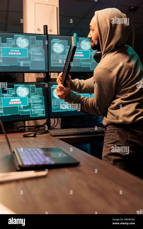 Displeased Angry Hacker Throwing Keyboard In Office Feeling Mad About