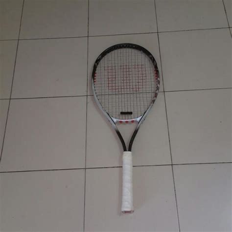 Wilson Titanium Racket Sports Equipment Sports And Games Racket And Ball Sports On Carousell