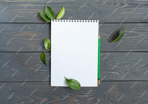 Premium Photo A Clean White Notebook Page With A Pencil On A Dark Wooden Background Space For Text Premium Photo A Clean White Notebook Page With A Pencil On A Dark Wooden Background Space For Text