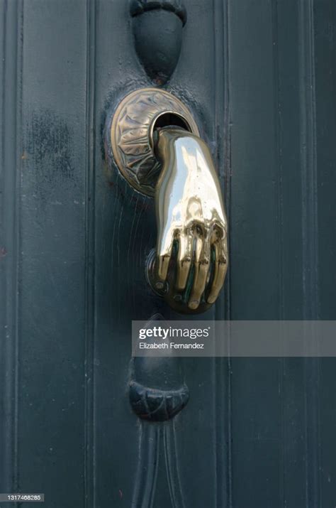 Hand Door Knocker Detail Of Door Knocker In Shape Of Hand Holding Ball