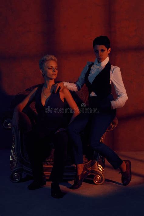 Two Lesbians With Serious Look In Old Armchair Stock Photo Image Of Lesbian Innocent