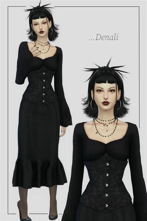 A Woman In A Black Dress With Long Sleeves And Pearls On Her Head