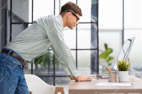 Premium Photo Young Modern Business Man Analyzing Data Using Computer While Working In The Office