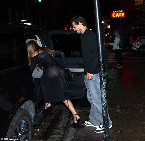 Braless Brooks Nader sizzles in a skintight maxi dress as she leaves dinner date holding hands ...