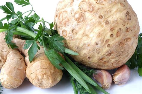 Ginger And Celery Root With Herbs And Garlic On A Light Background 1