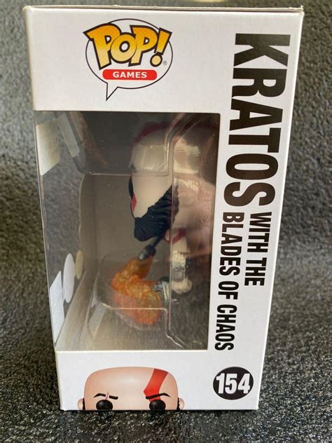 Funko Pop Kratos with blades of chaos GITD, Hobbies & Toys, Toys ...