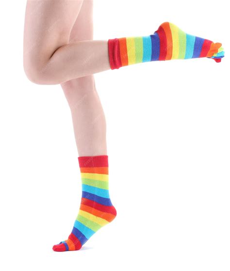 Premium Photo Female Legs In Colorful Striped Socks Isolated On White