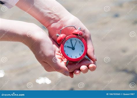 Alarm Clock In Female Hands Symbol Of Fast Passing Time Stock Image Image Of Color Countdown